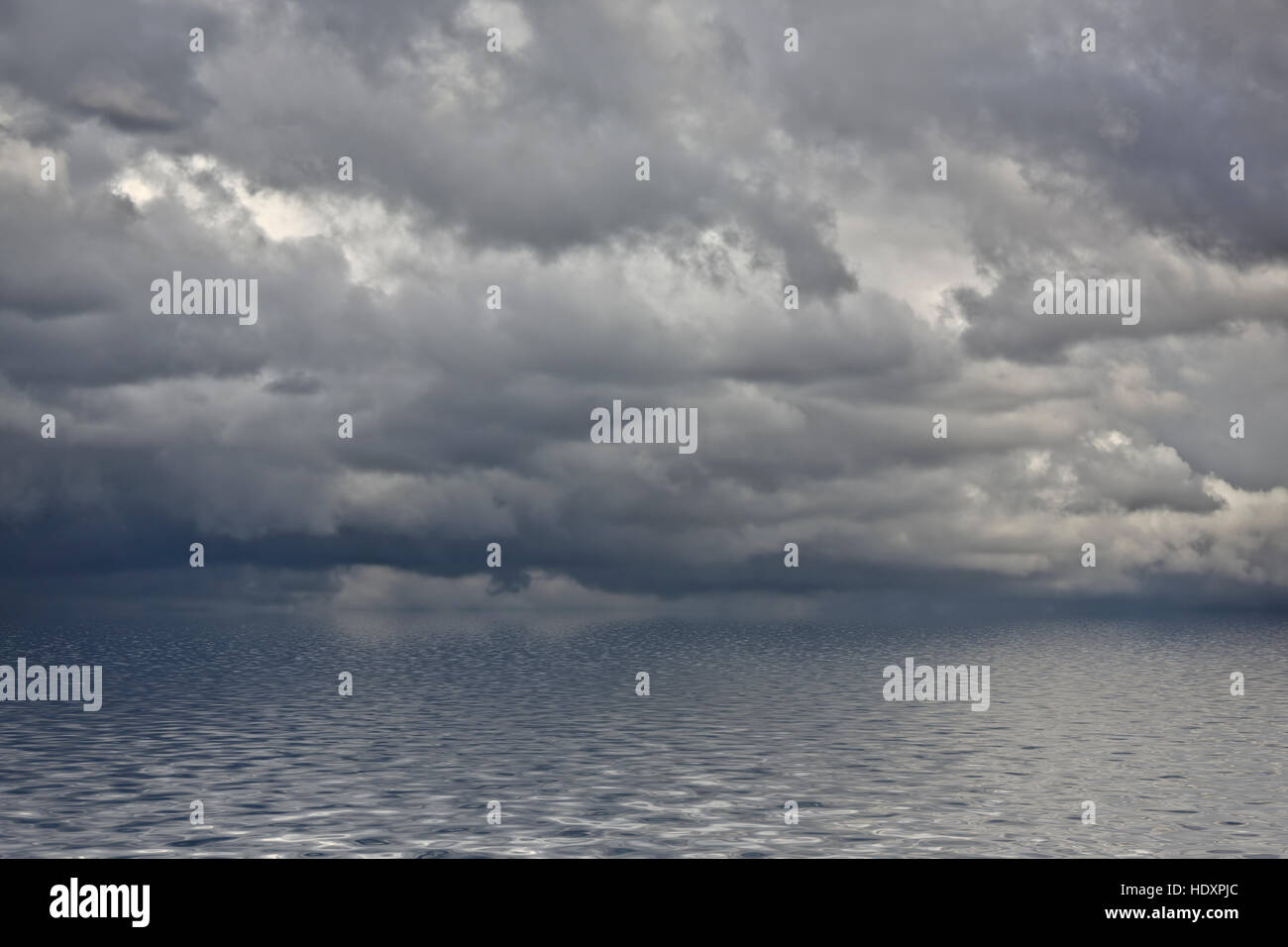 White and gray storm clouds over dark water Stock Photo - Alamy