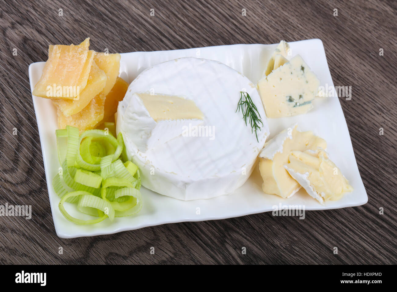 Cheese platter with brie, blue and parmesan Stock Photo - Alamy