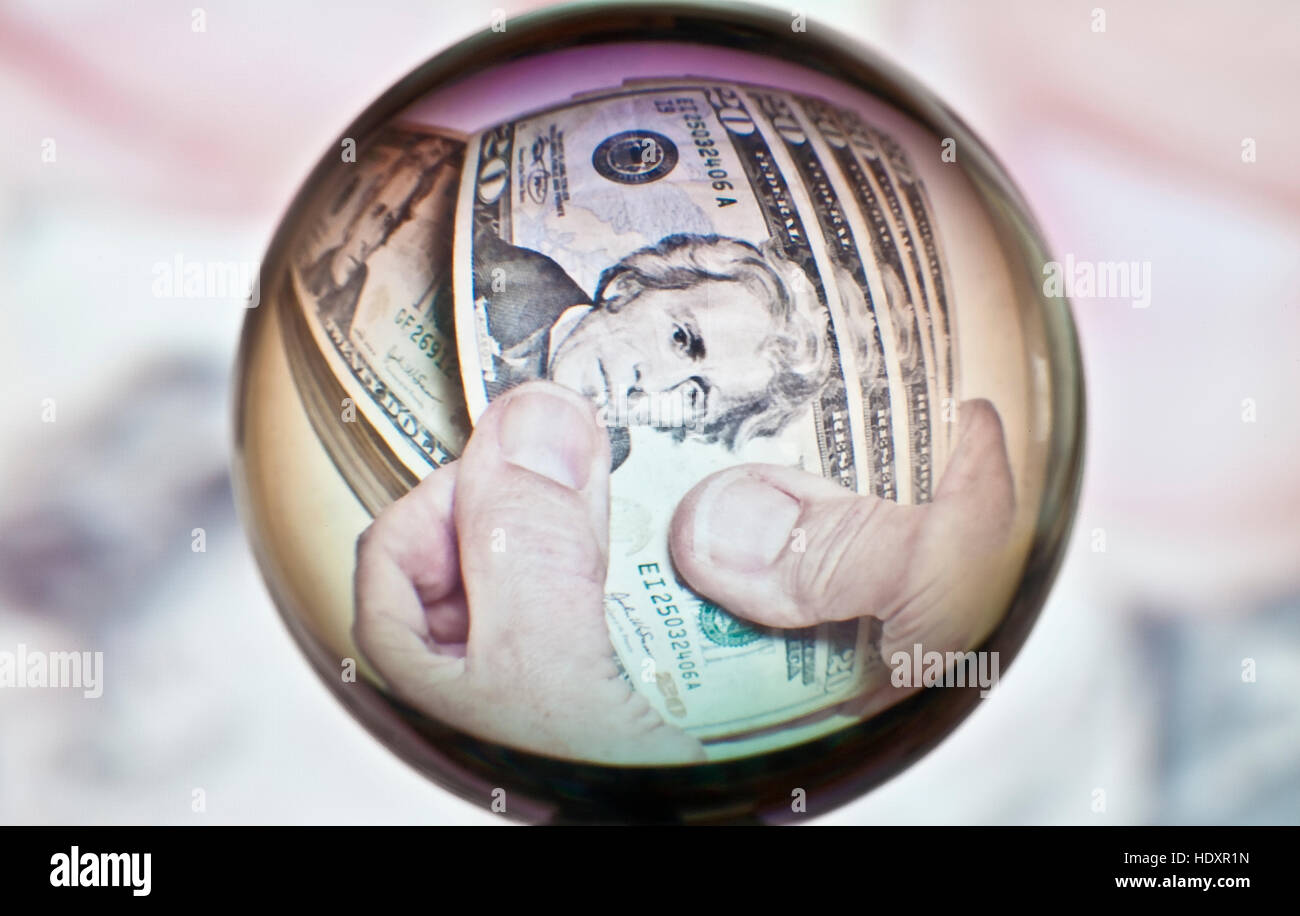 Older man's hands counting twenty dollar bills onto a stack on white ...