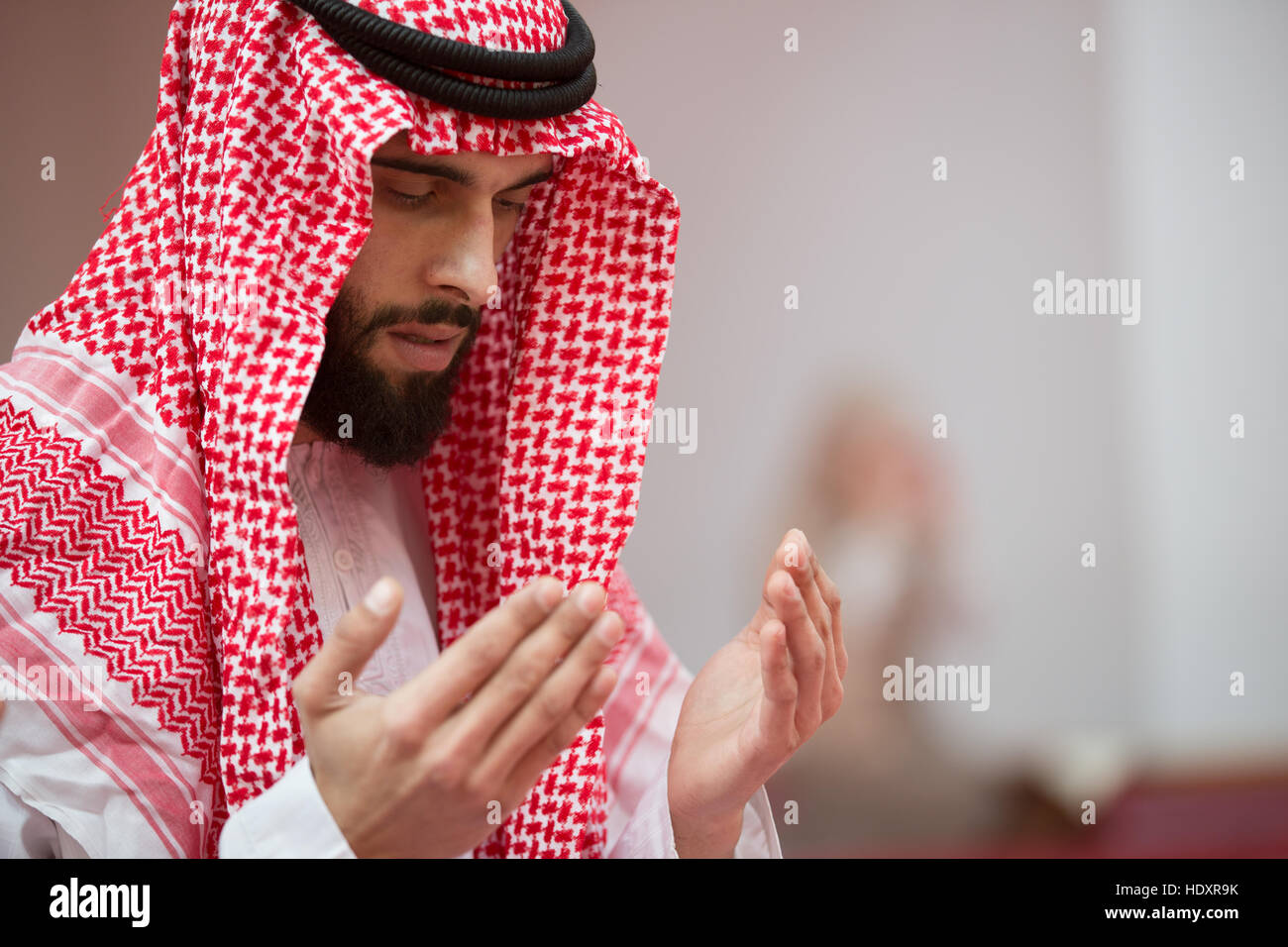 Two religious muslim man praying together inside the mosque Stock Photo ...