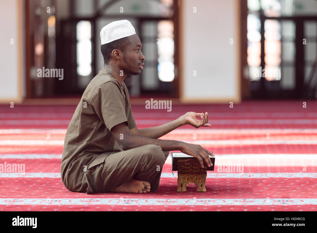 Black African Muslim Man Reading Holy Islamic Book Koran Stock Photo ...