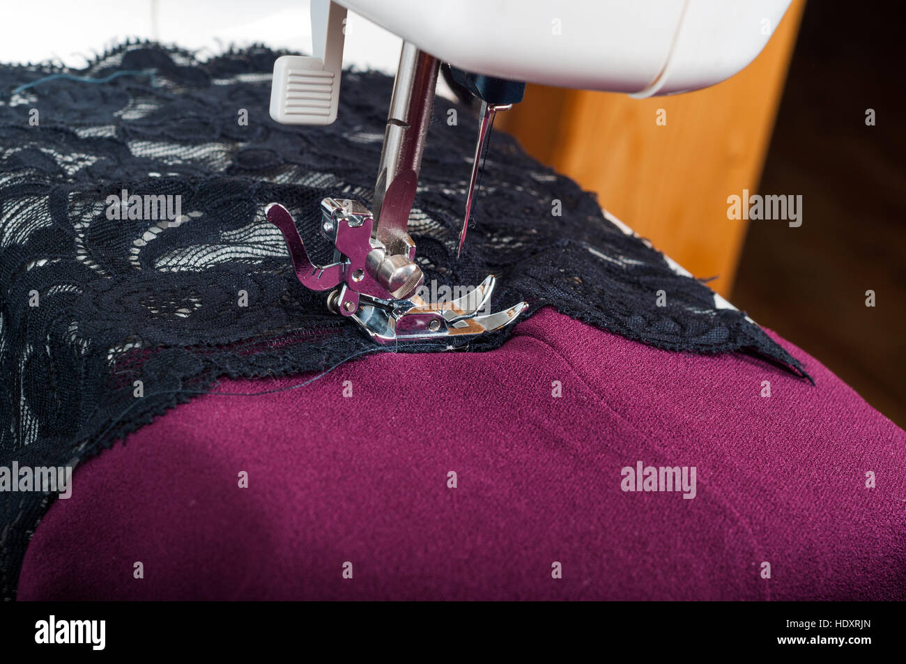 Sewing dress with machine Stock Photo - Alamy