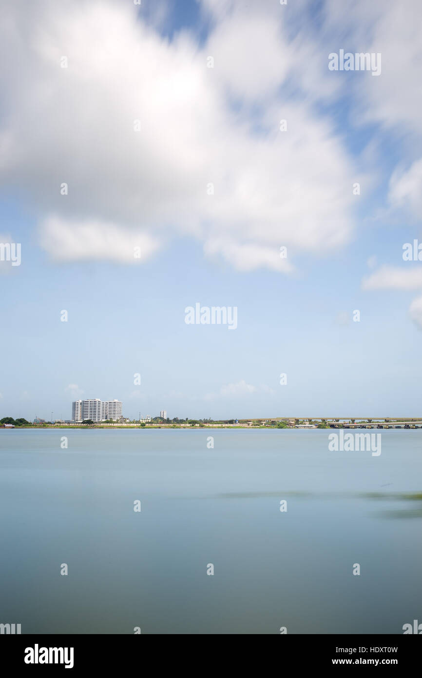 Long exposure of a high rise and a bridge from Bolgatty island Kochi ...