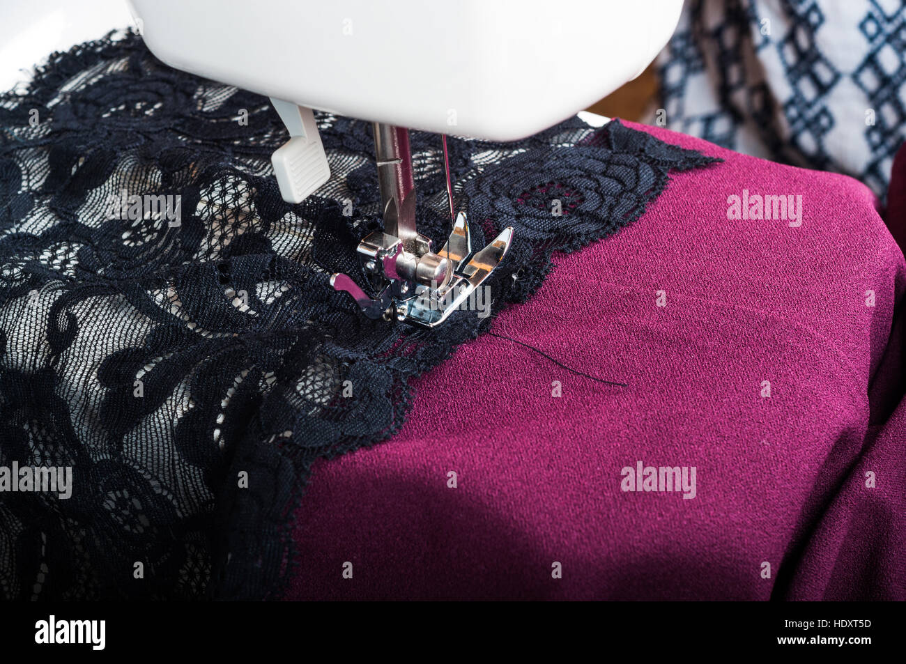 Sewing dress with machine Stock Photo - Alamy
