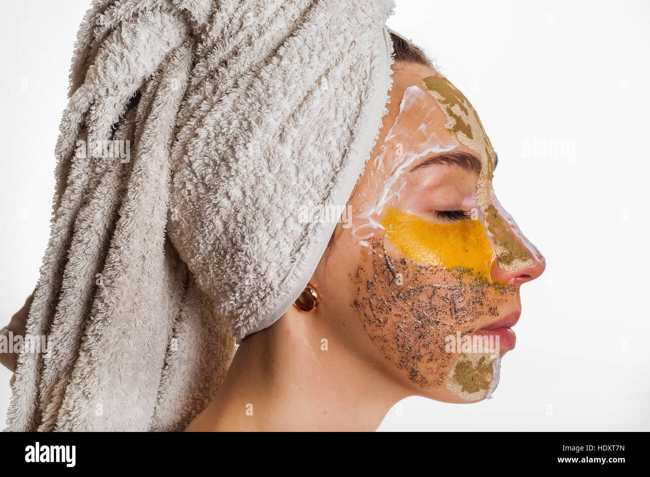 Woman with different masks on her face multi-masking Stock Photo - Alamy