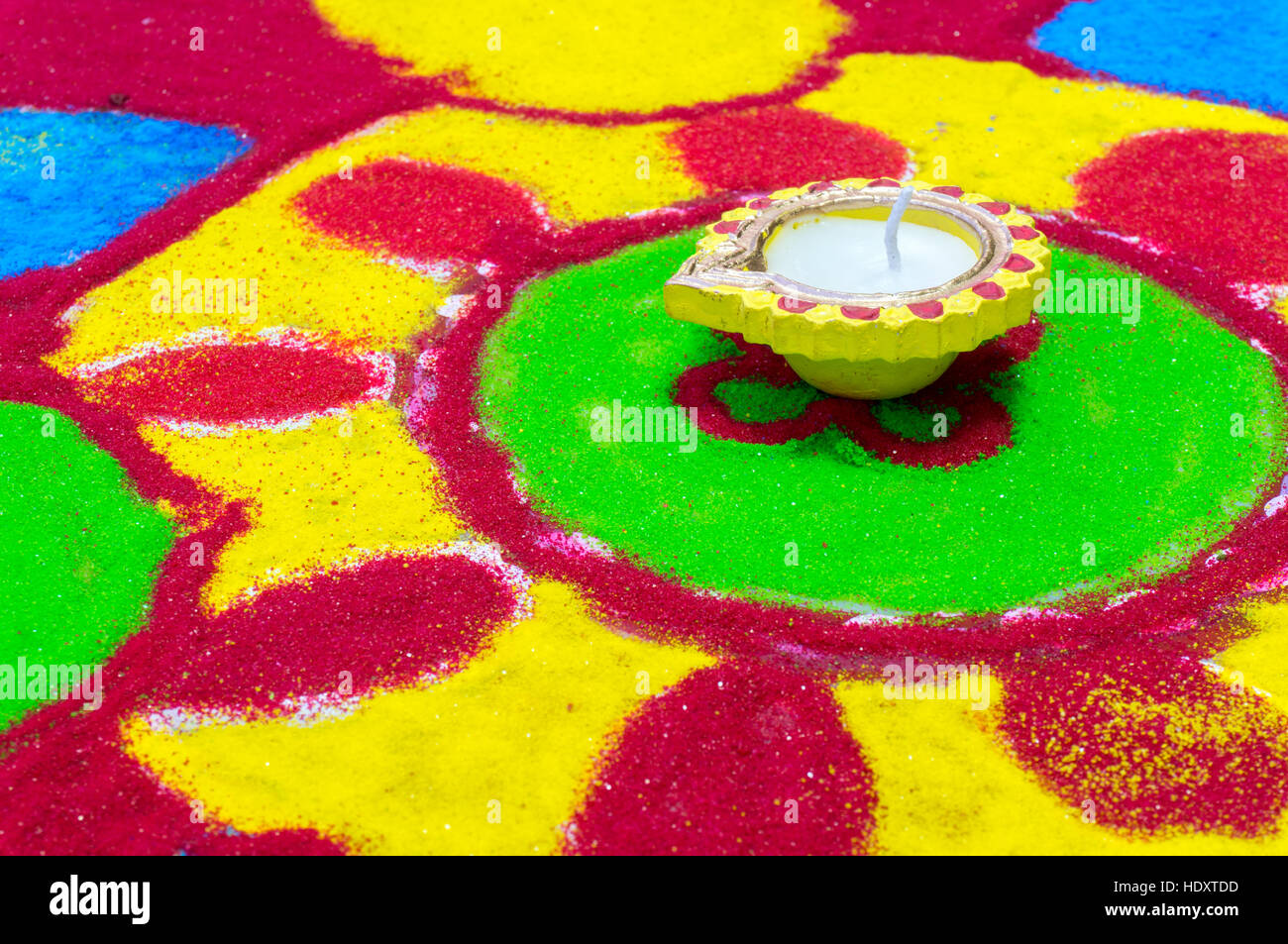 clay diya on a colorful rangoli Stock Photo - Alamy