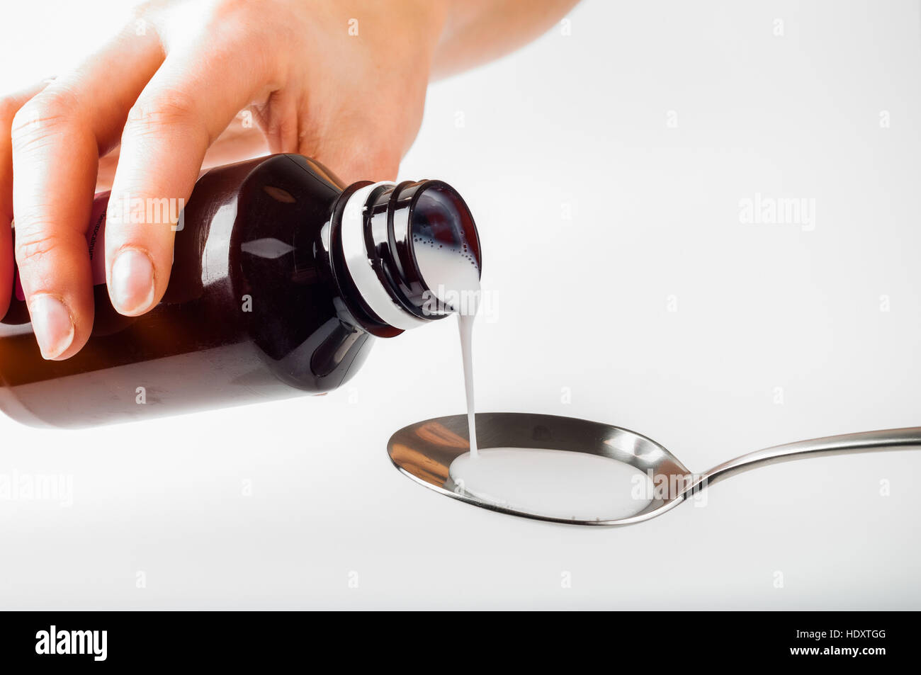 Medicine and spoon hi-res stock photography and images - Alamy