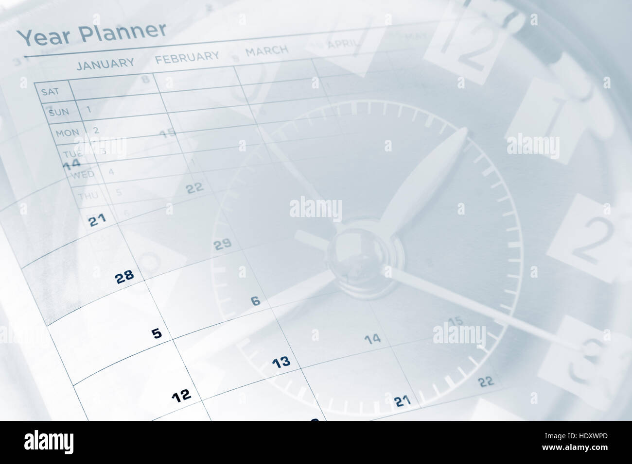 Clock face and year planner calendar Stock Photo - Alamy