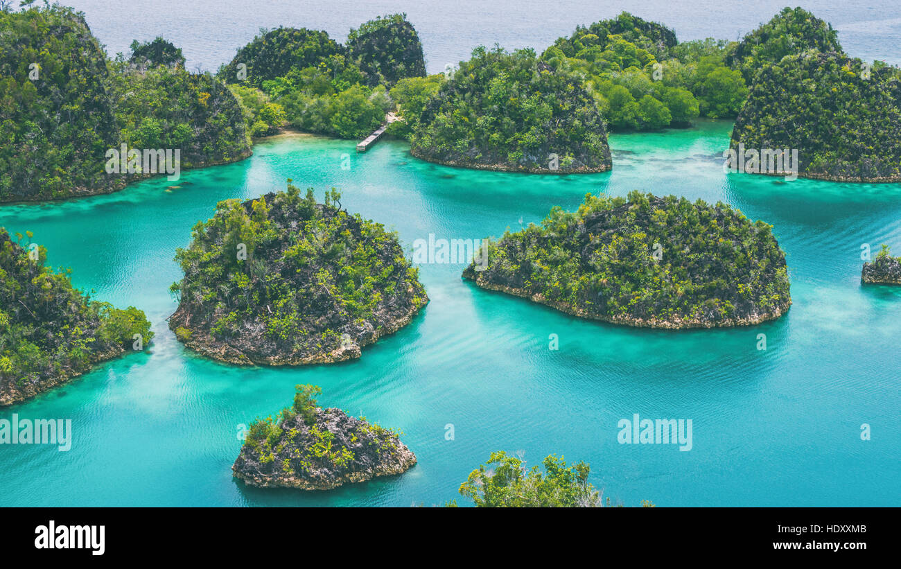 Group of Painemo Island surrounded by Blue Lagoon, Ocean, Raja Ampat ...