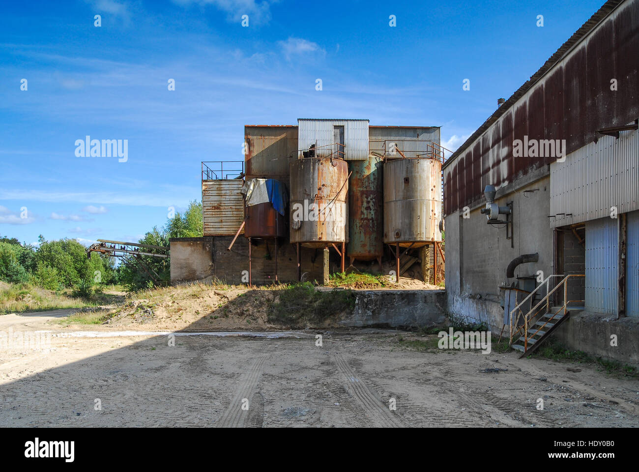 Old abandoned defaulted industrial building which stands with rusty and ...
