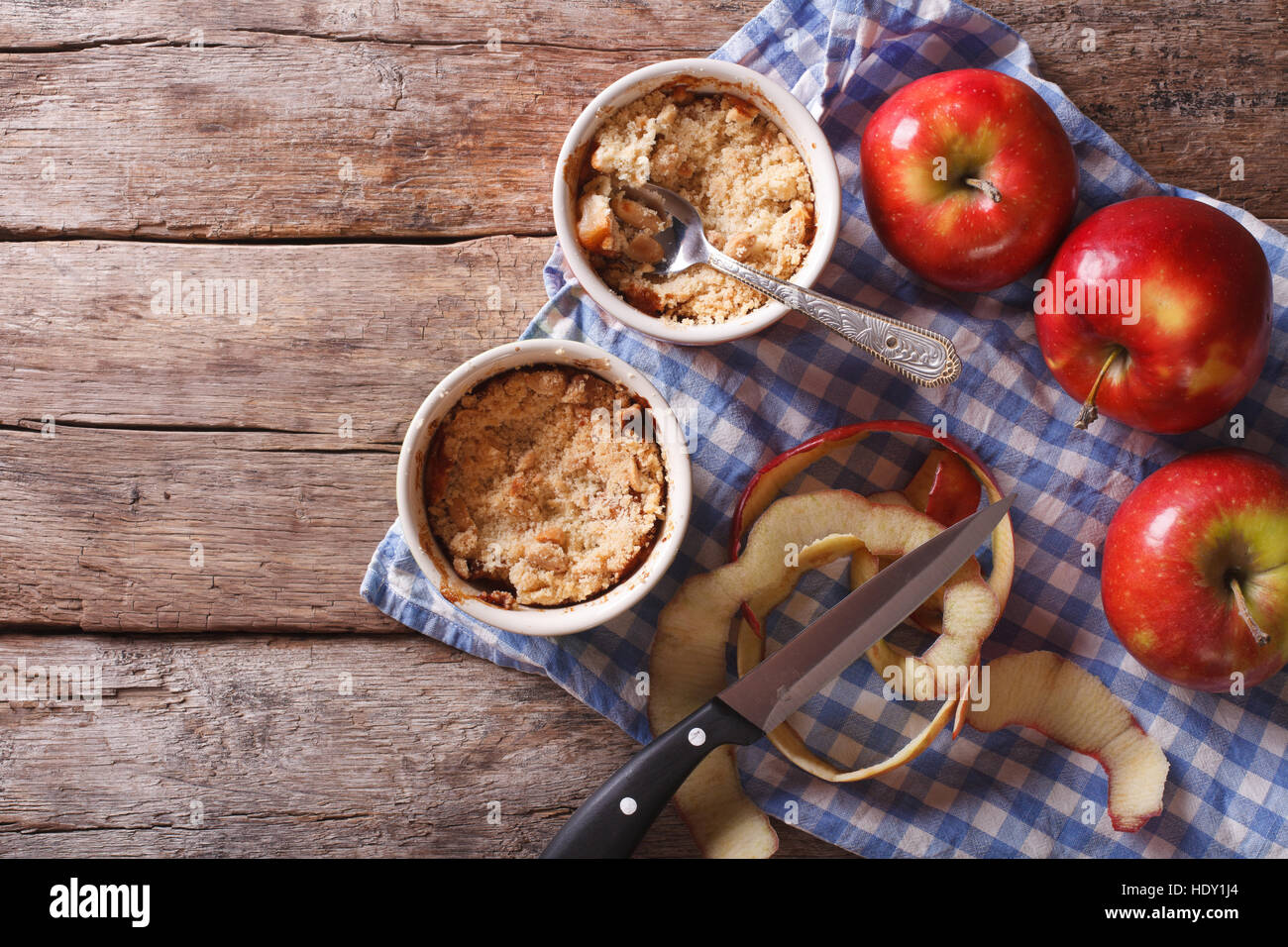 Traditional apple crumble in the pot on the table. horizontal view from ...