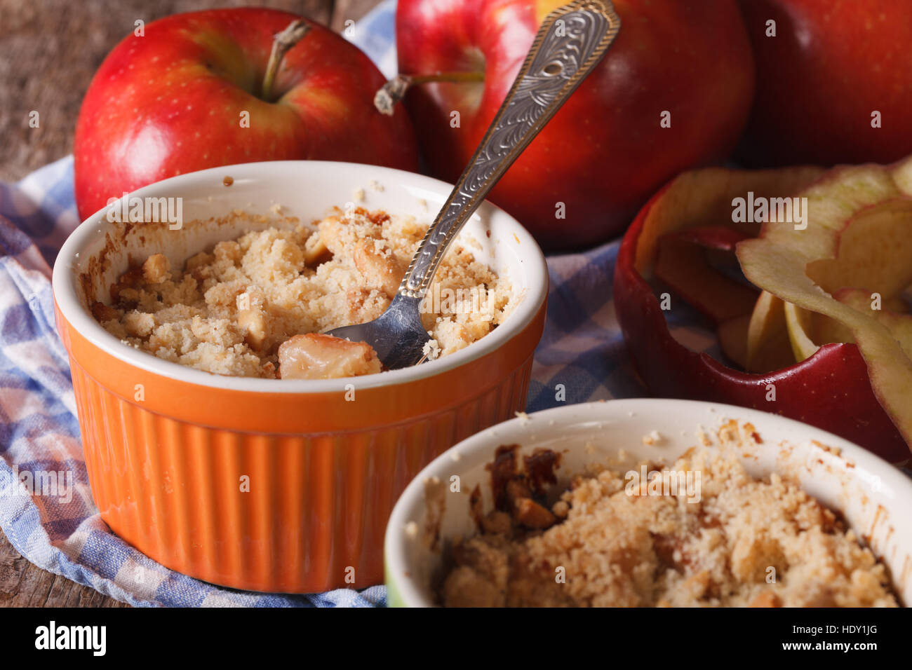 English crumble with apples close-up in the pot. Horizontal rustic ...