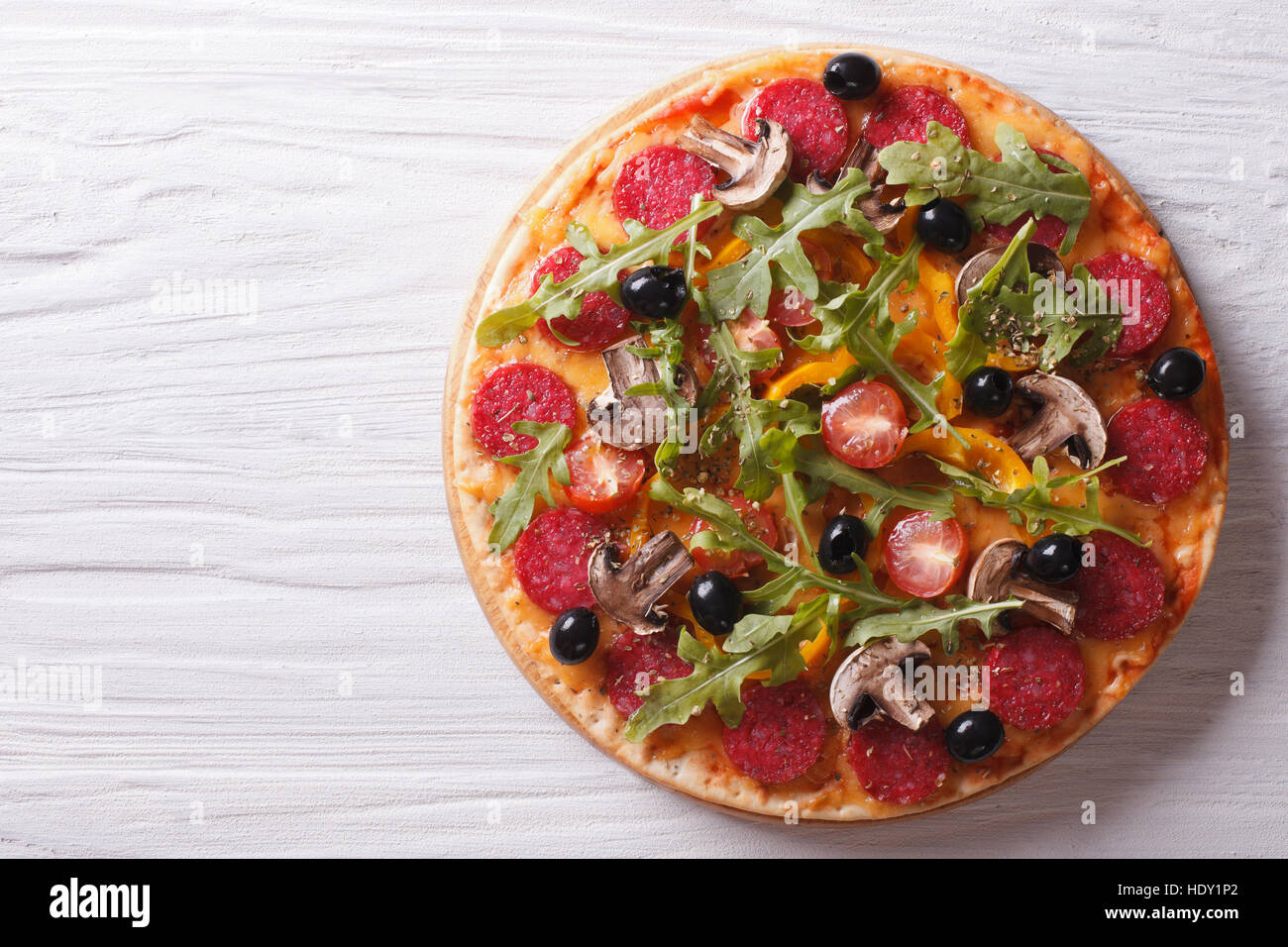 Hot Italian pizza with rucola and salami, horizontal view from above ...
