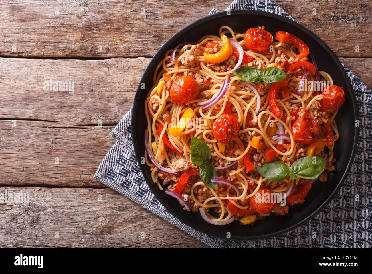Spaghetti with minced meat and vegetables. horizontal top view, rustic ...