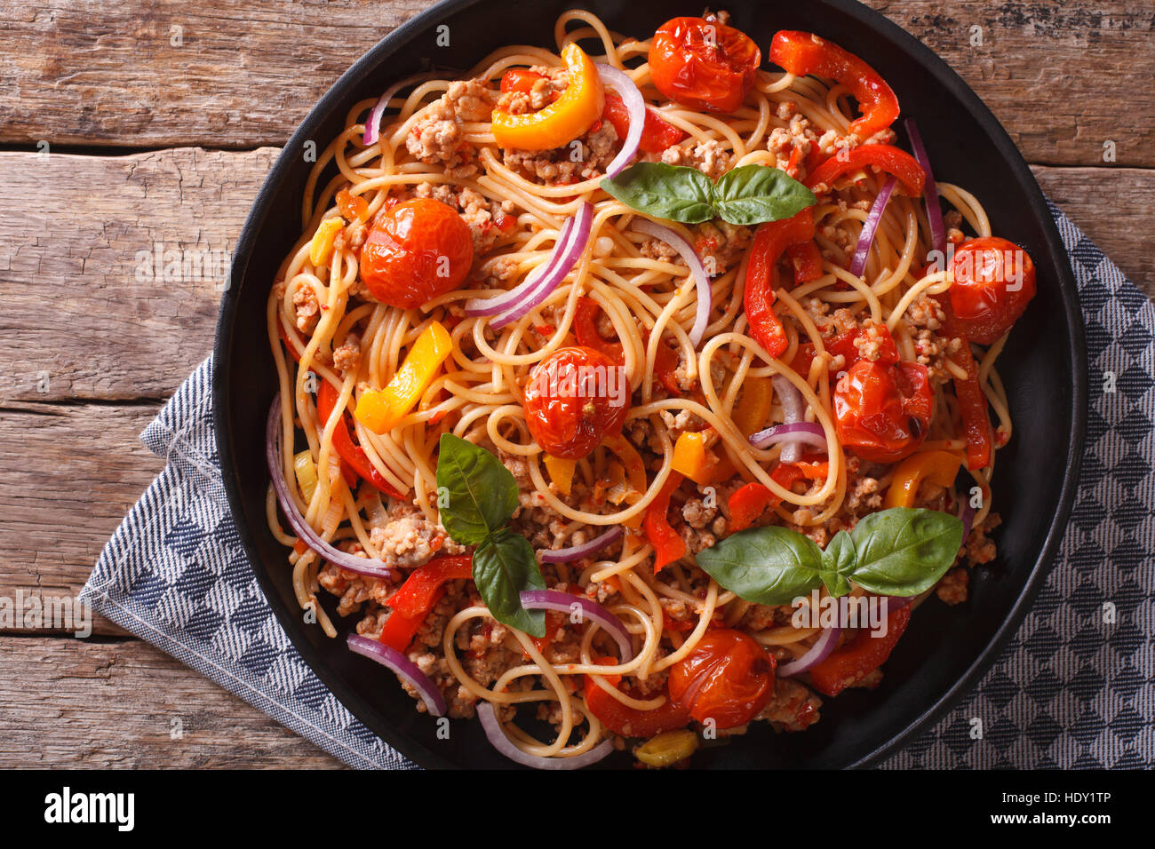 Spaghetti with minced meat and vegetables close-up. horizontal top view ...