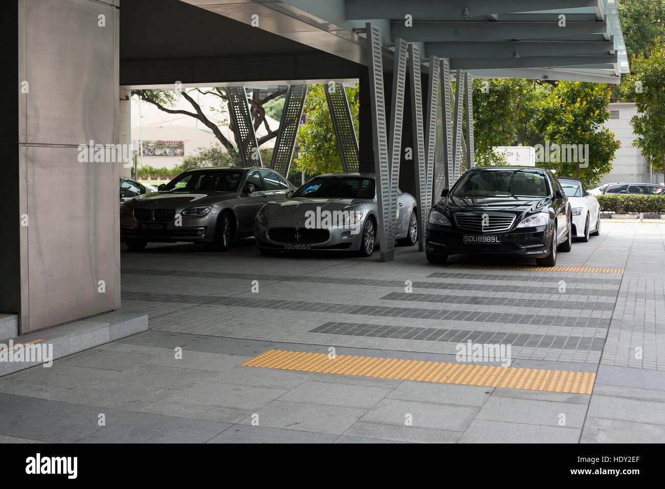 Premium cars on parking in the city at daytime Stock Photo - Alamy
