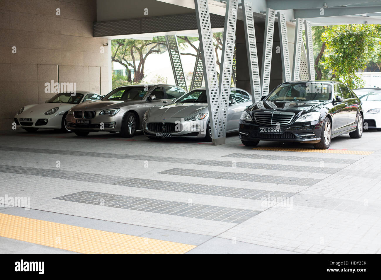 Premium cars on parking in the city at daytime Stock Photo - Alamy