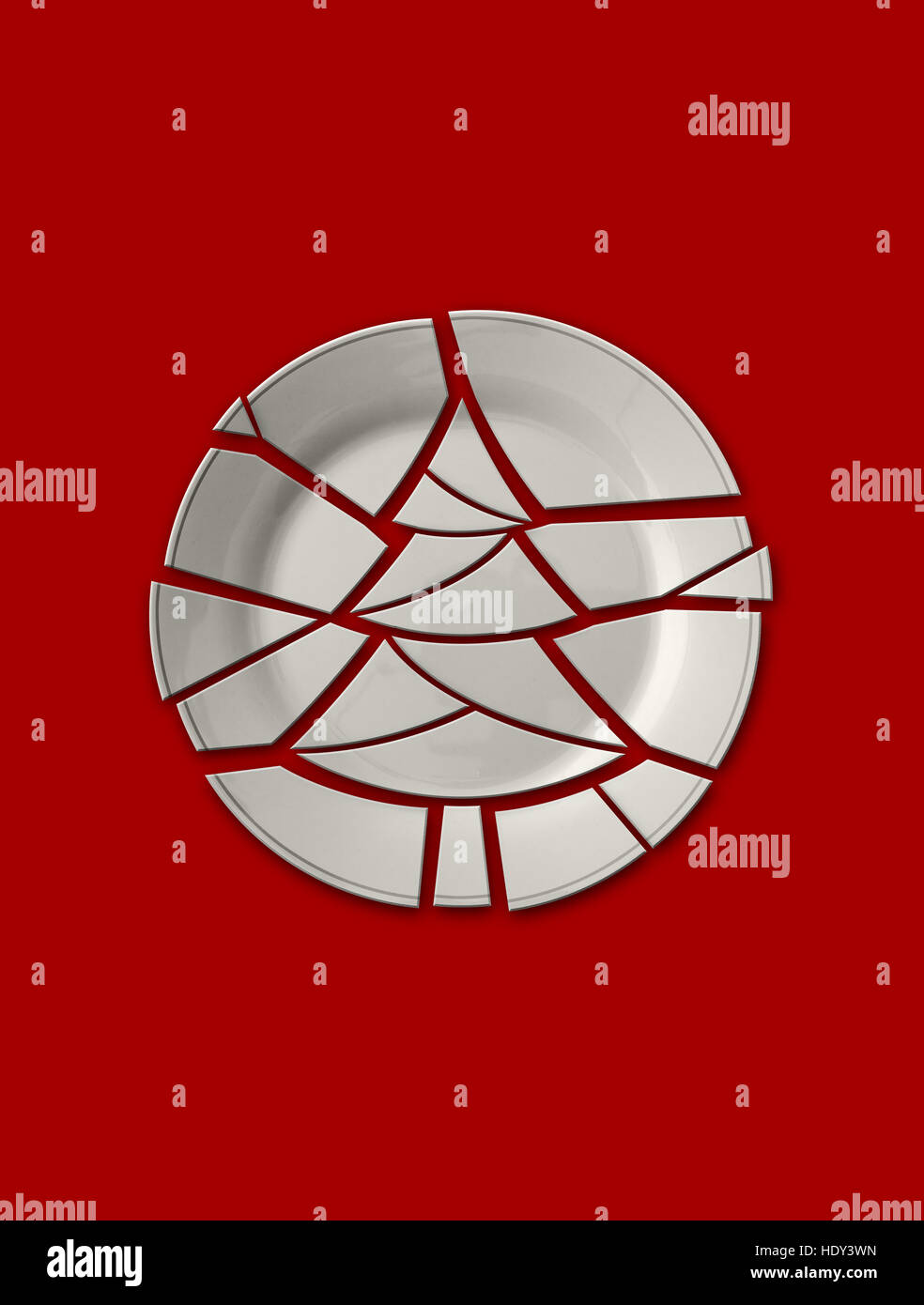Isolated broken plate in the shape of christmas tree on solid red color ...