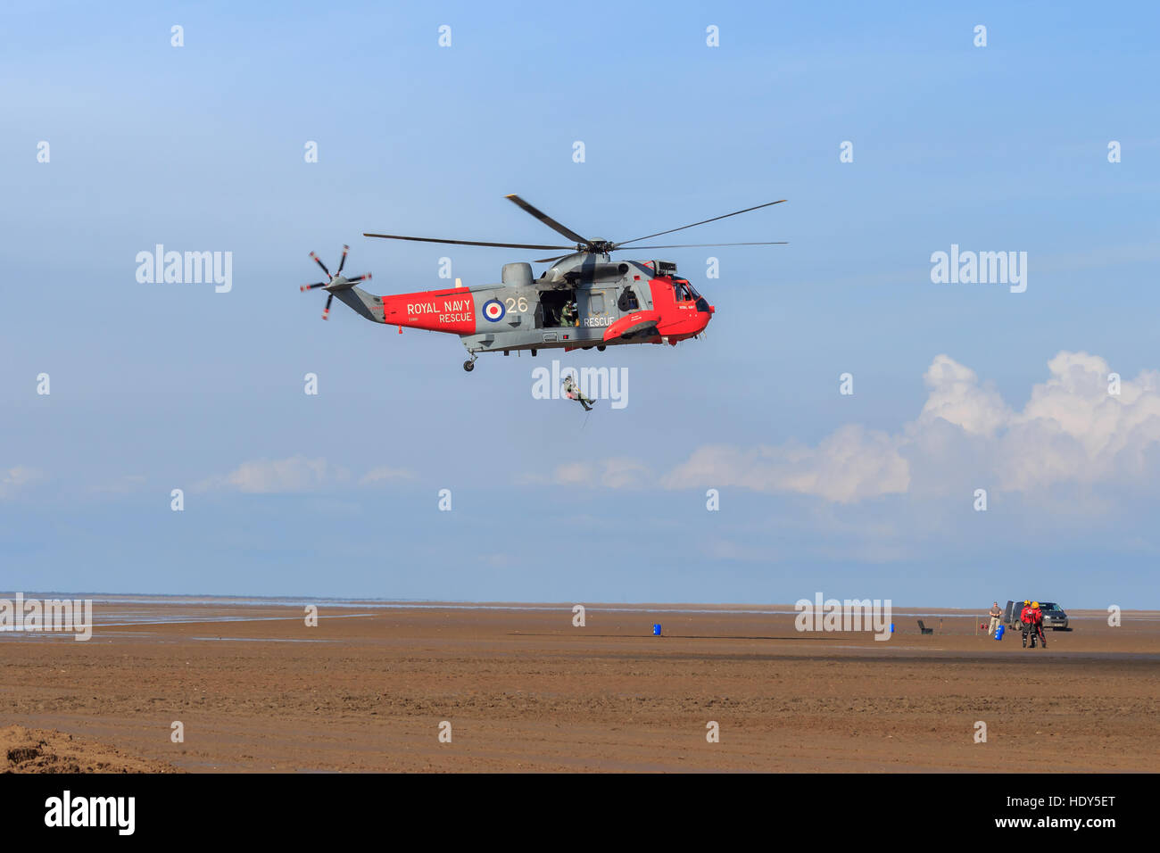 Royal Navy Seaking Search and Rescue helicopter performing mock rescue ...