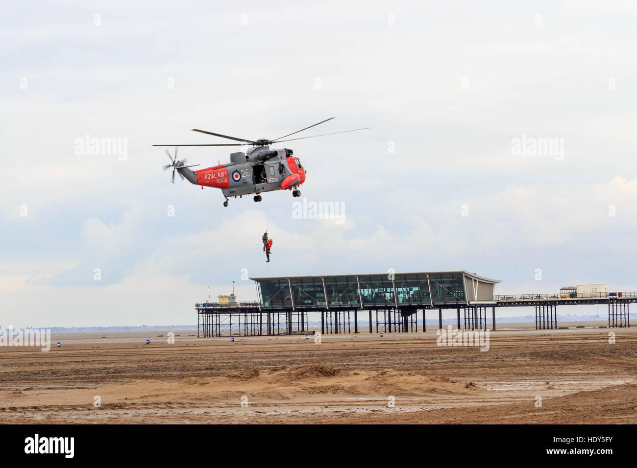 Royal Navy Seaking Search and Rescue helicopter performing mock rescue ...