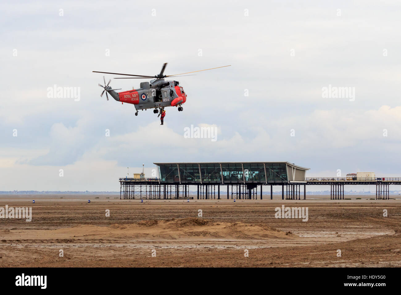 Royal Navy Seaking Search and Rescue helicopter performing mock rescue ...