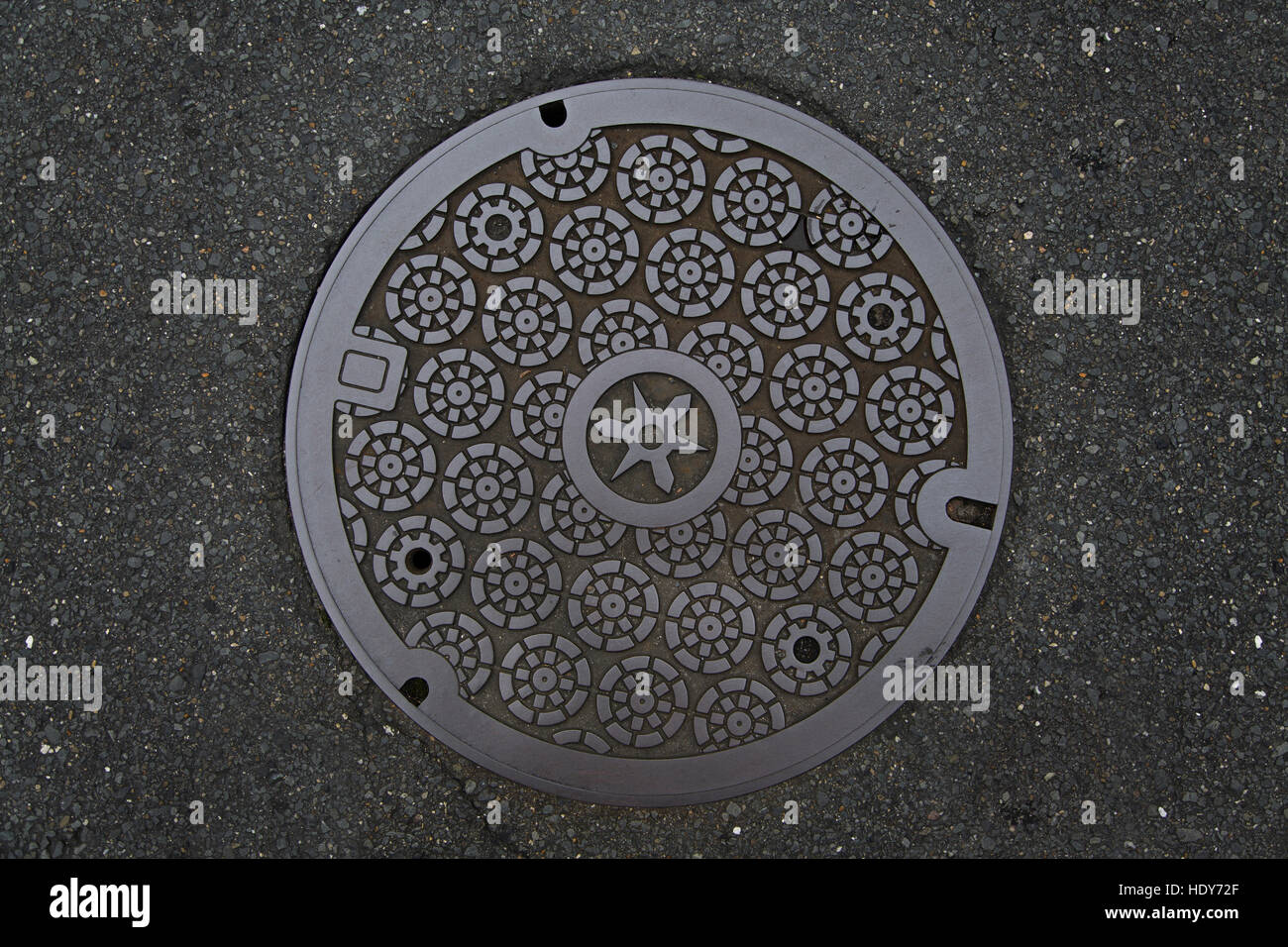 Circle steel manhole cover or metal sewer on the street in Japan Stock ...