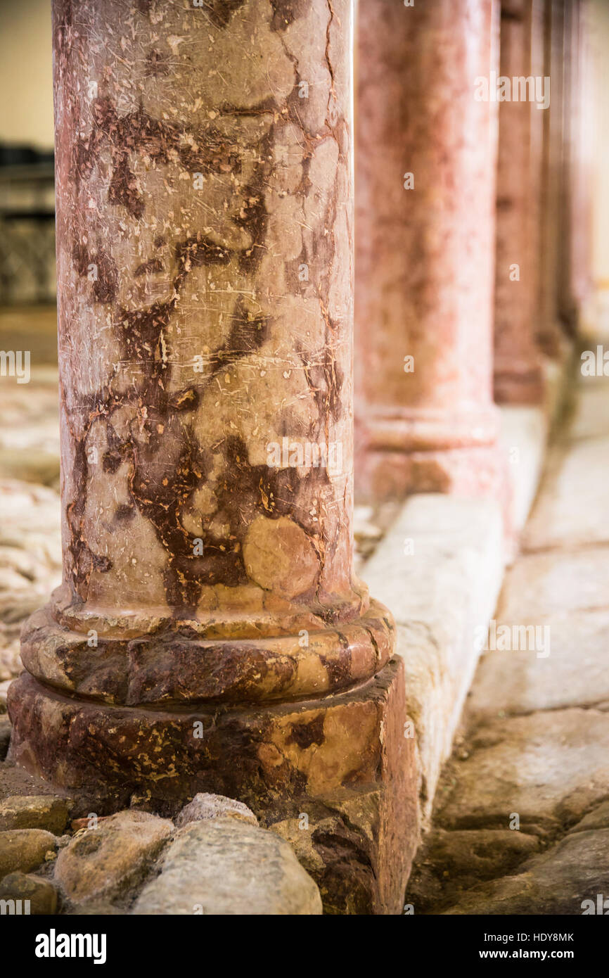 Antique red marble columns resting on stone floor Stock Photo - Alamy