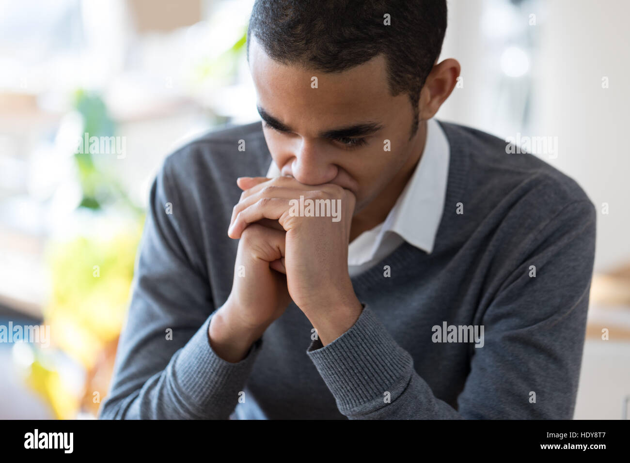 handsome businessman thinking or worried in an open space or large ...