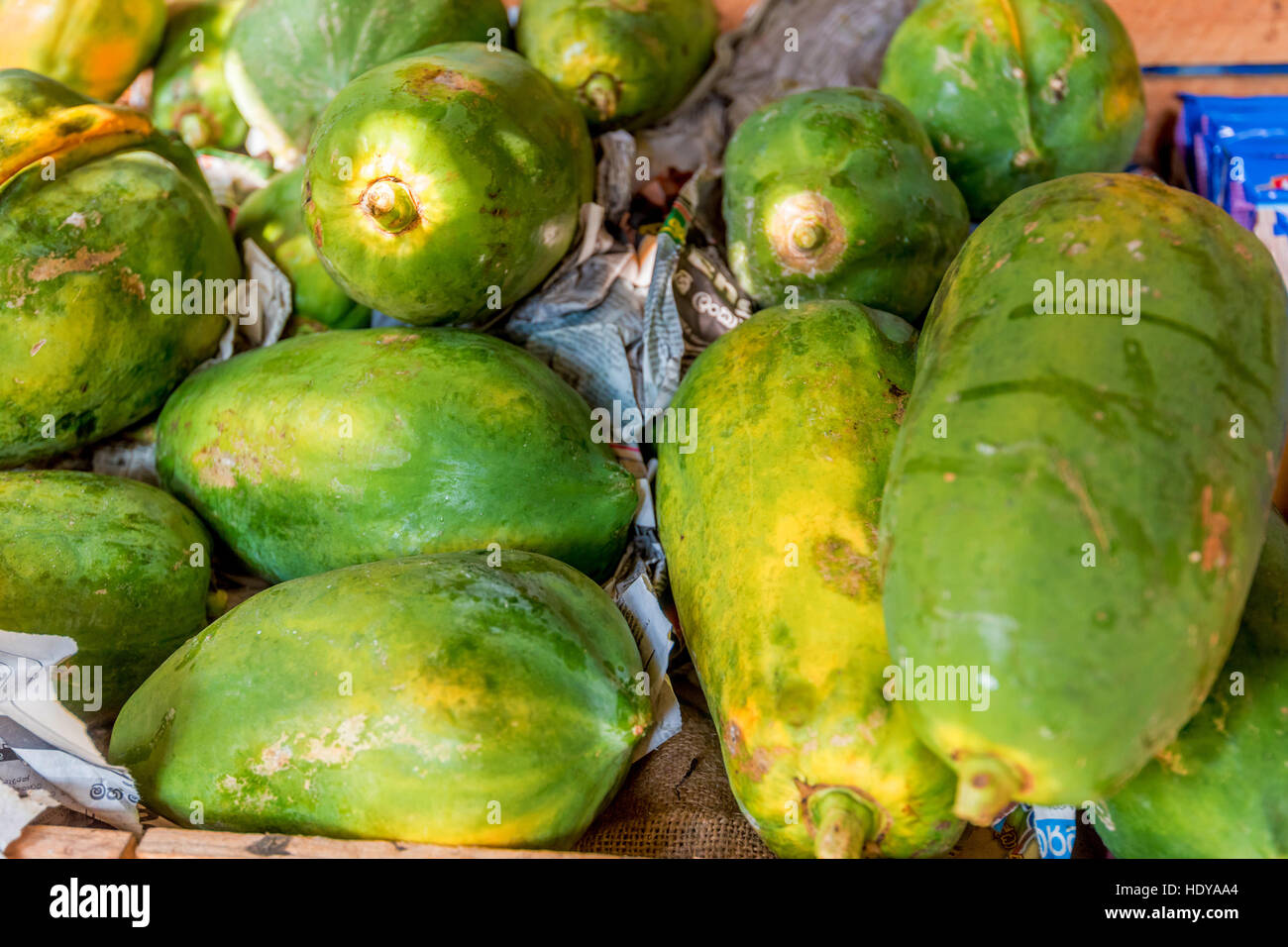 Green papaya in native market Stock Photo - Alamy