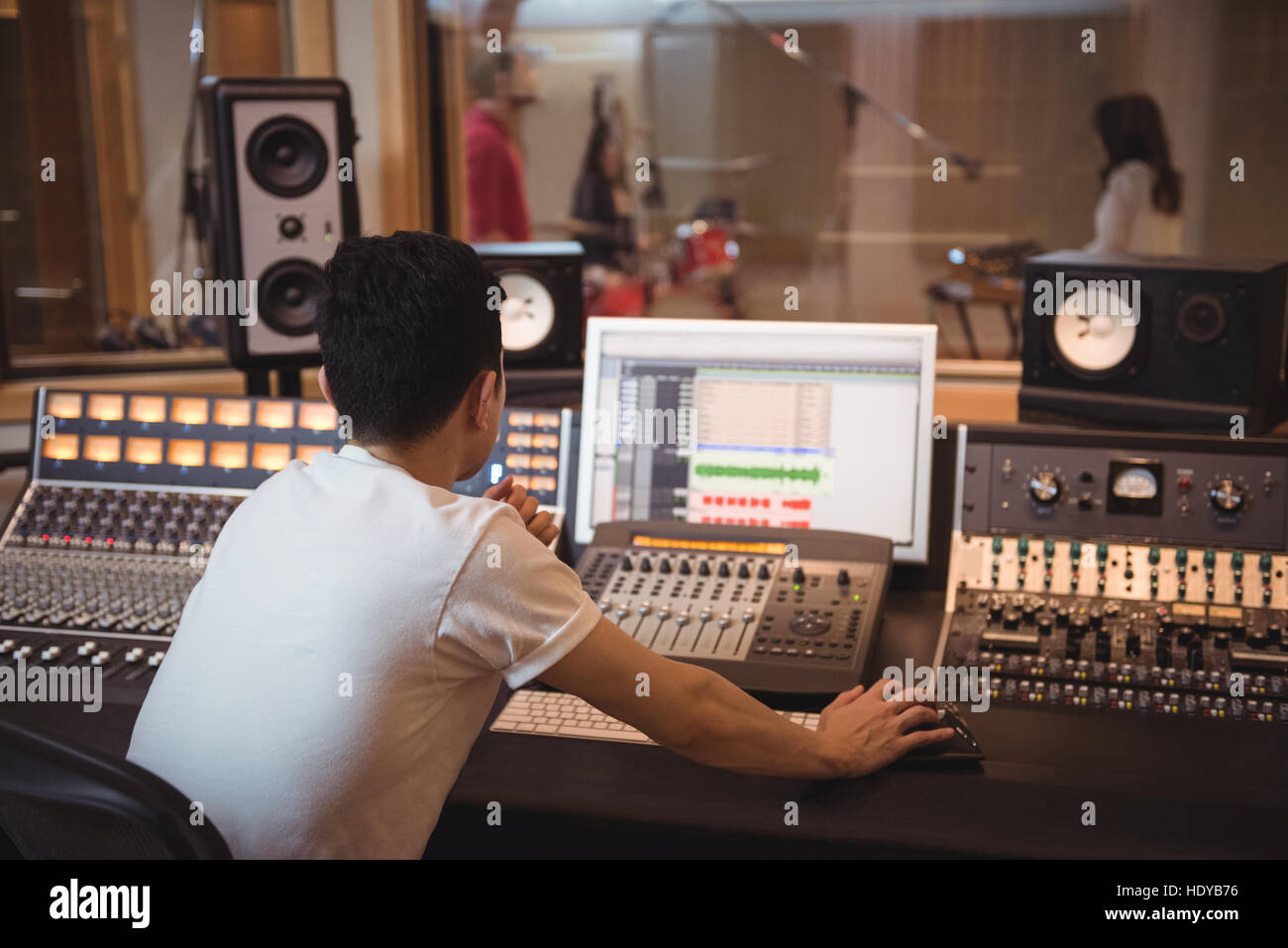 Audio engineer using sound mixer in recording studio Stock Photo - Alamy