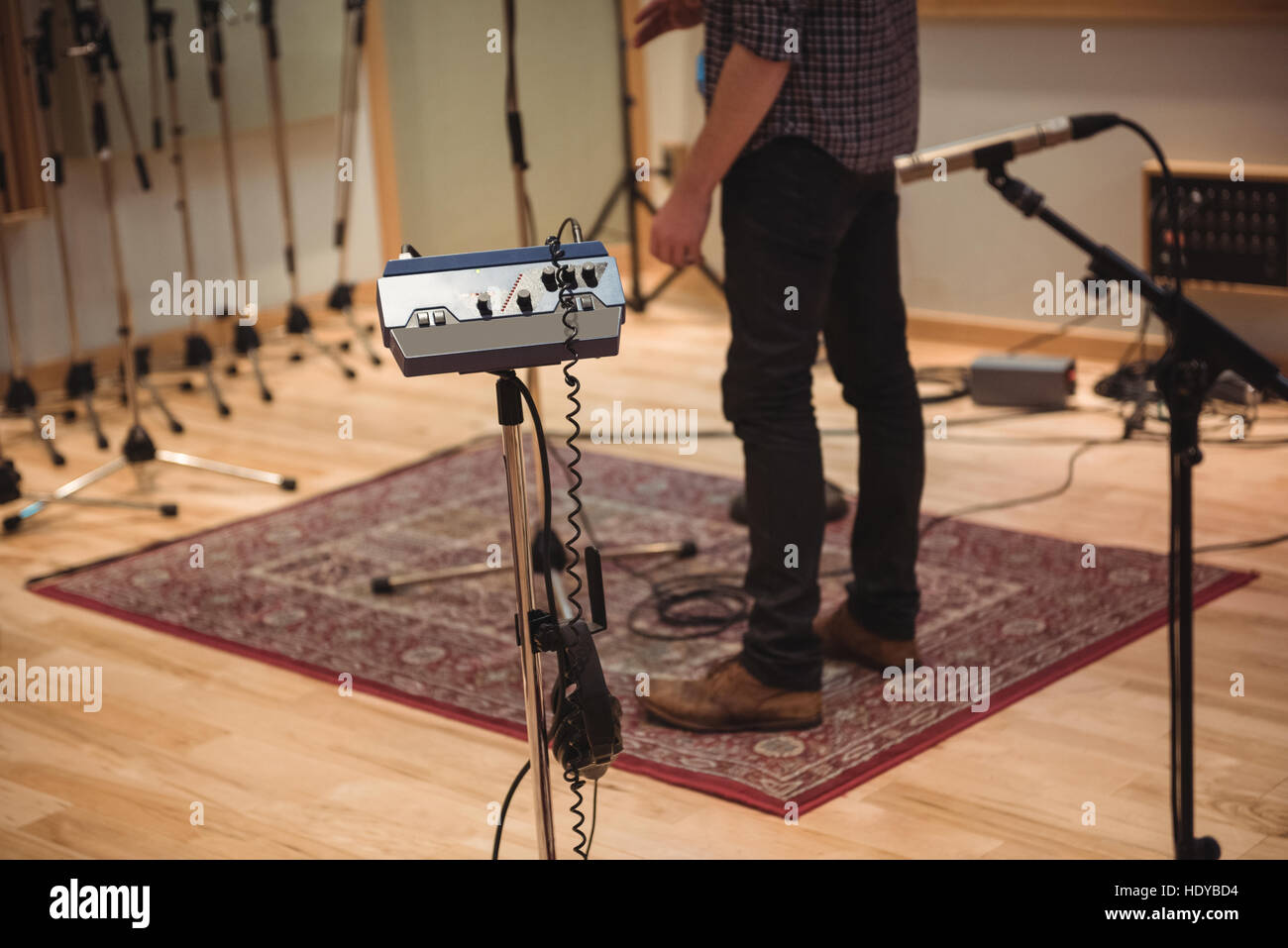 Low section of man standing in music studio Stock Photo - Alamy
