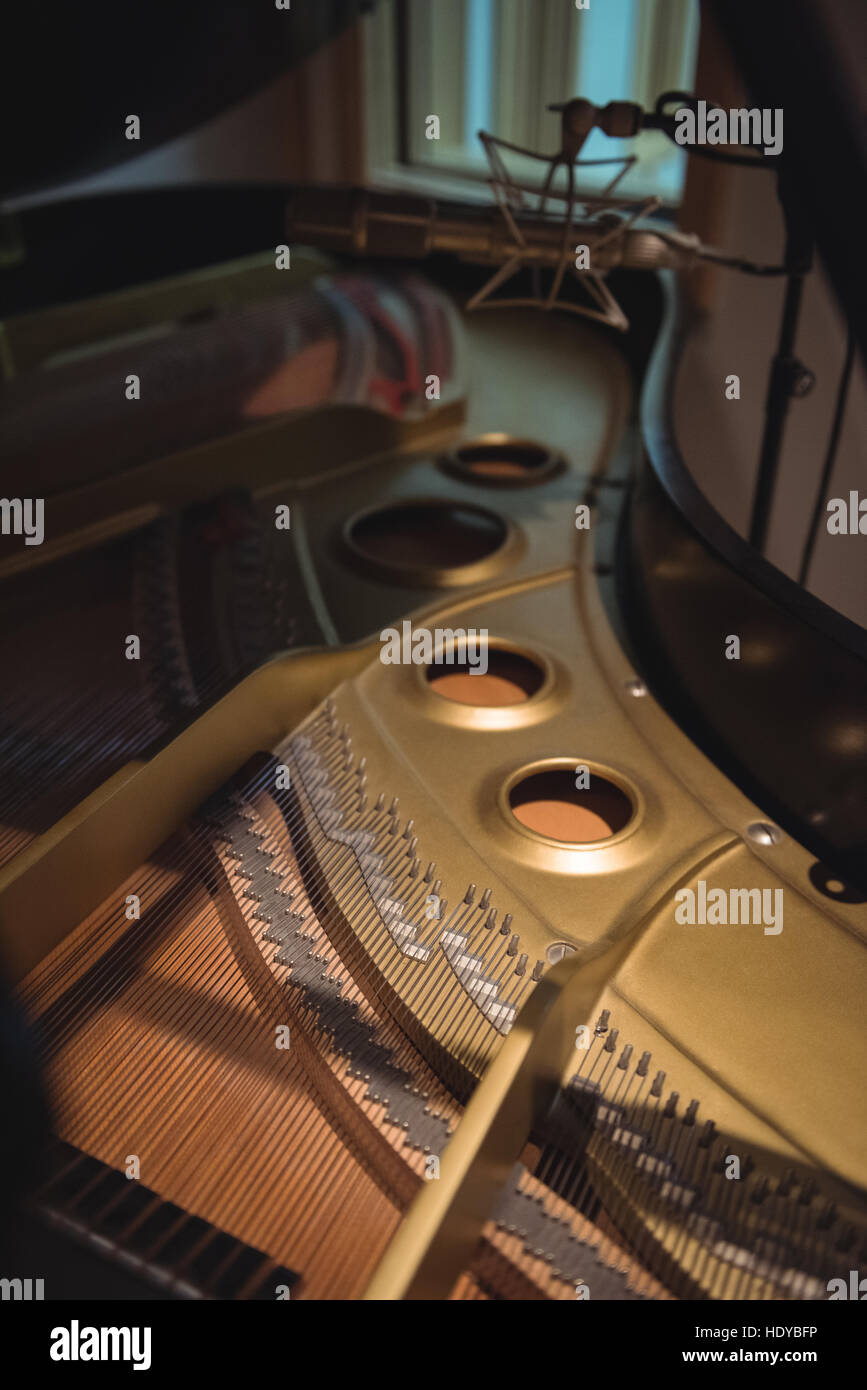 Piano cast iron plate and strings in recording studio Stock Photo - Alamy