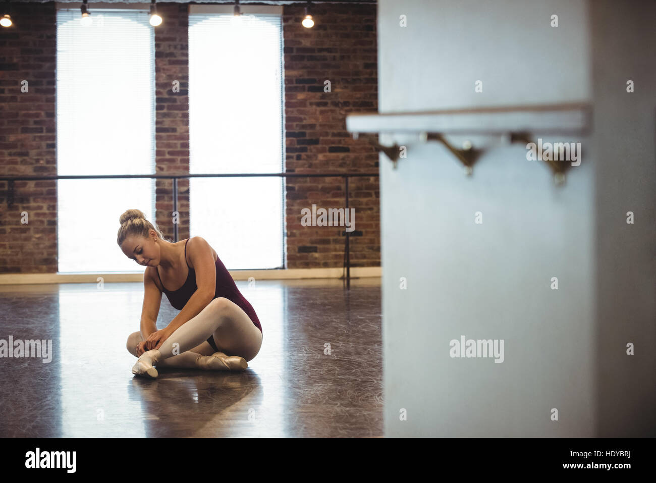 Ballerina wearing ballet shoes in the studio Stock Photo - Alamy