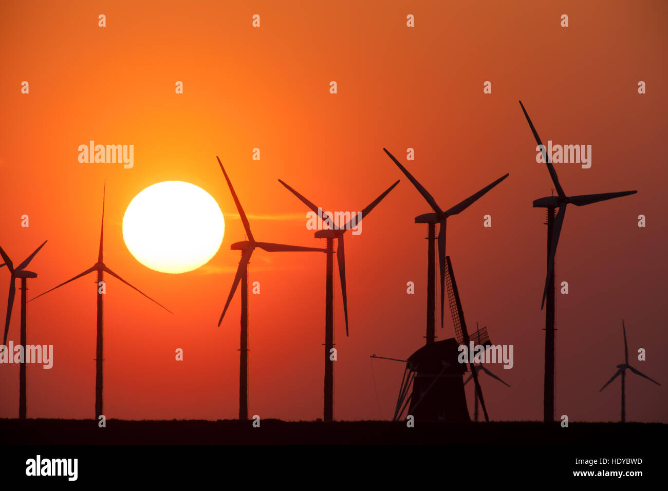 Wind turbines at the Eemshaven at sunset, Groningen, Netherlands Stock ...