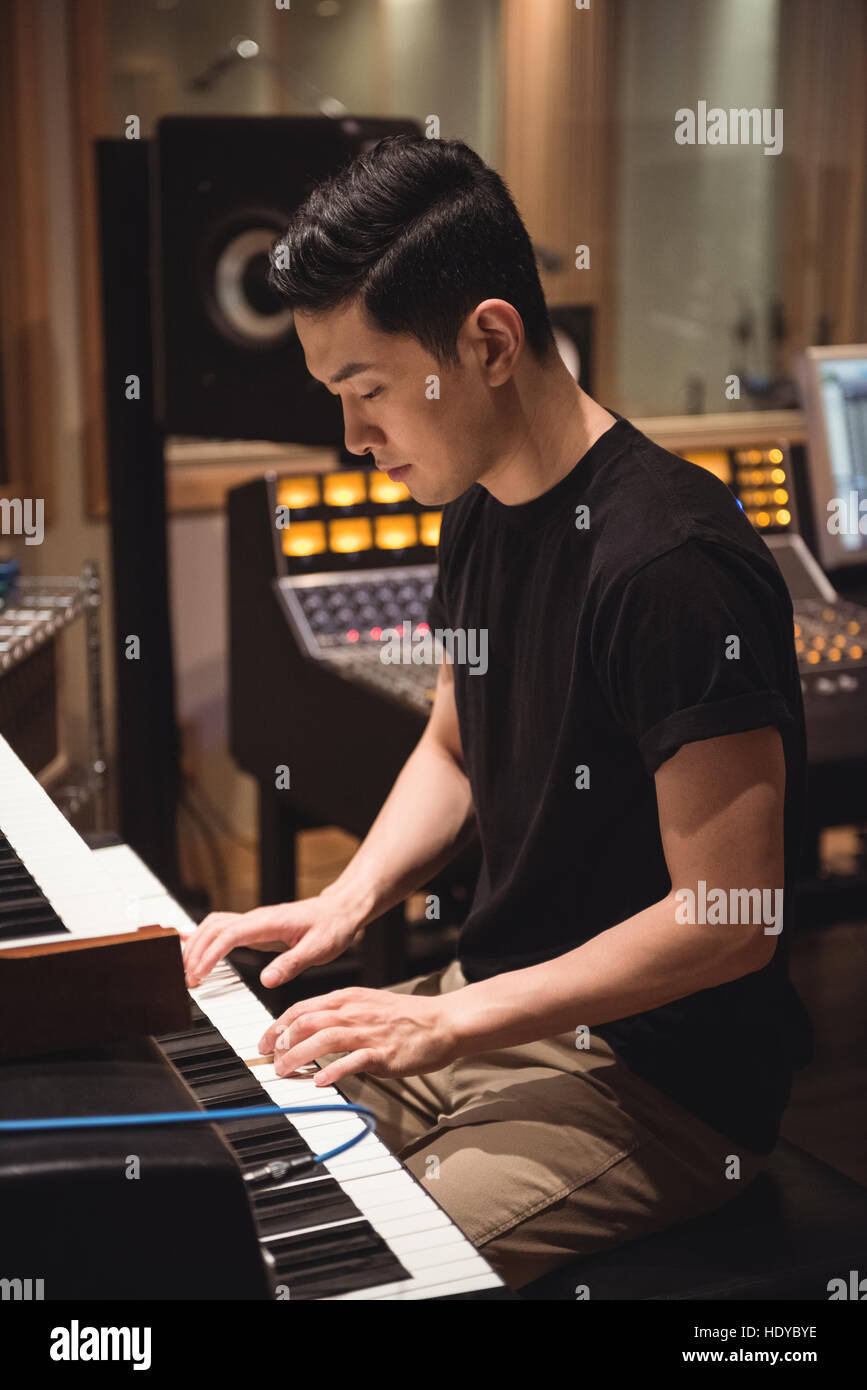 Asian man sitting piano hi-res stock photography and images - Alamy