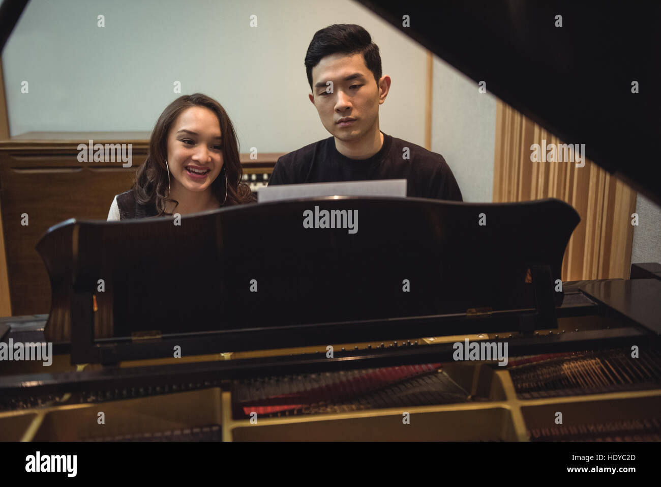 Couple at a piano hi-res stock photography and images - Alamy