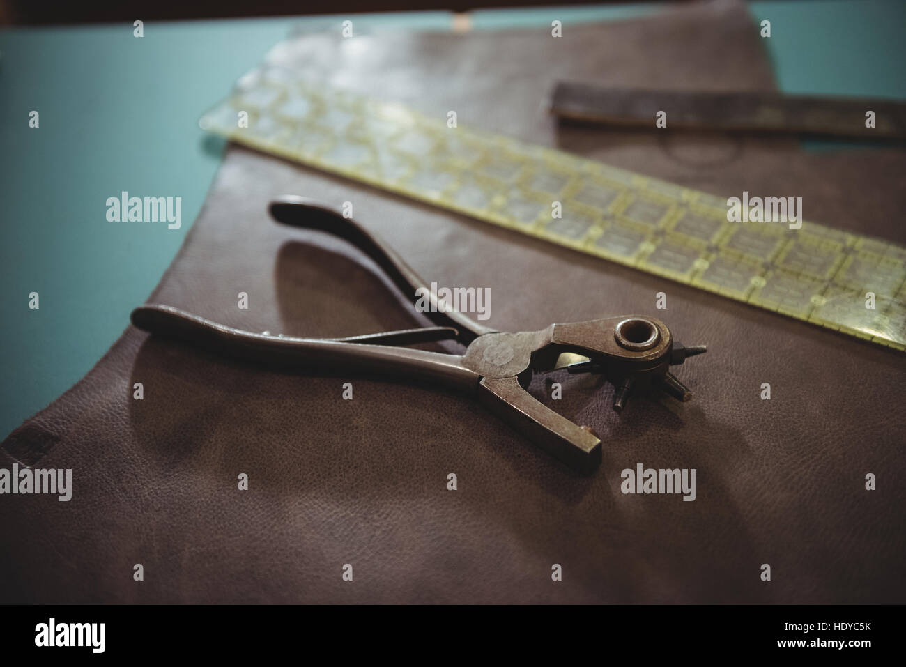 Tool leather hole belt punching hi-res stock photography and images - Alamy