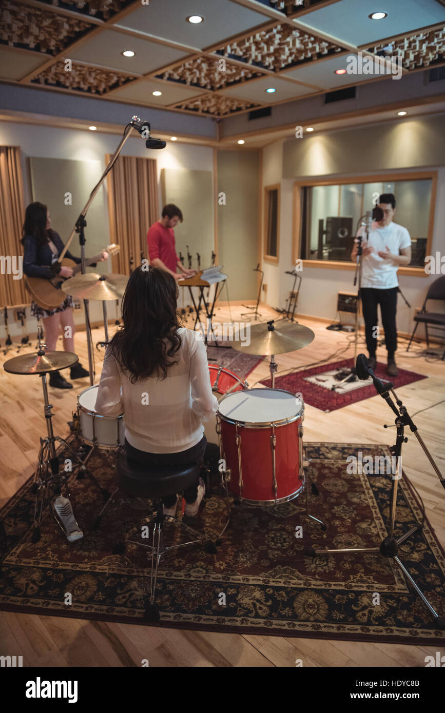 Music band performing in a recording studio Stock Photo - Alamy