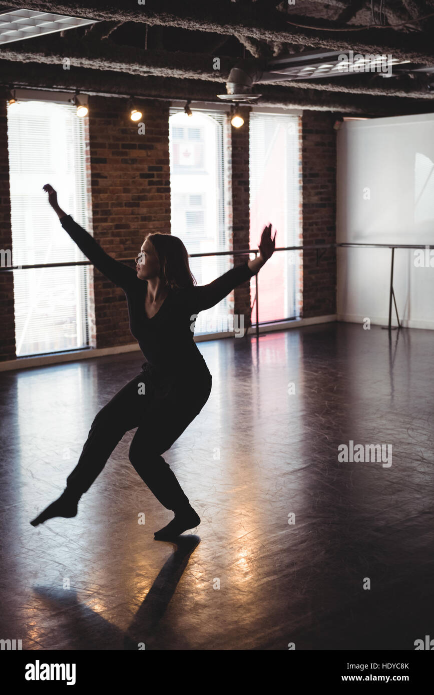 Woman practicing dance in dance studio Stock Photo - Alamy
