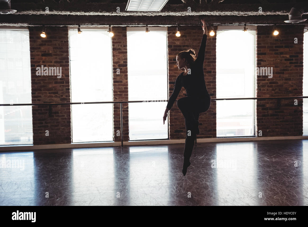 Woman practicing dance in dance studio Stock Photo - Alamy