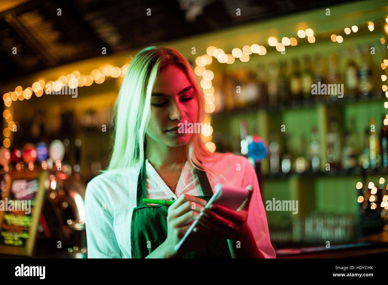 Waitress writing ordering on notepad hi-res stock photography and ...