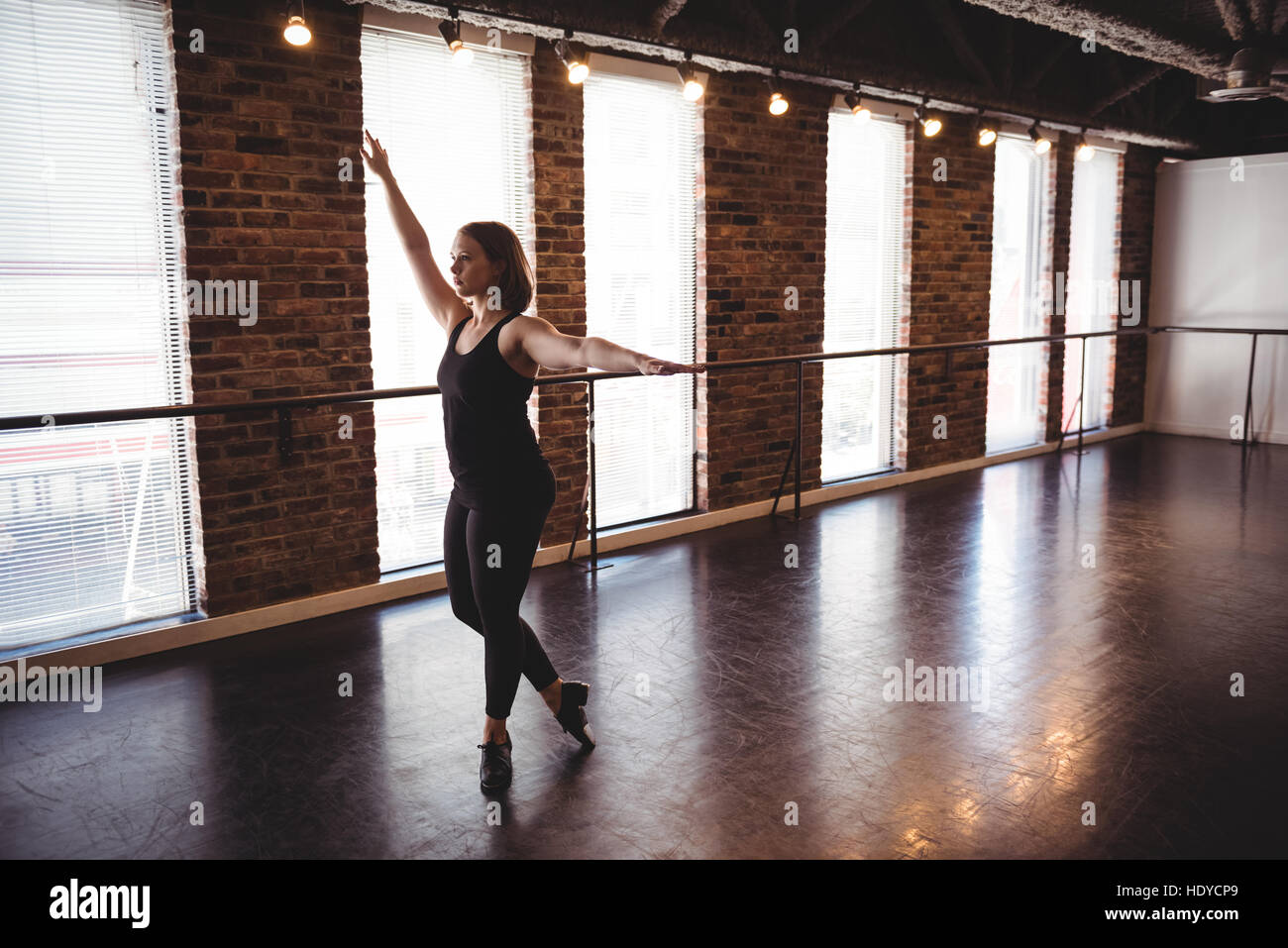 Woman practicing dance in dance studio Stock Photo - Alamy