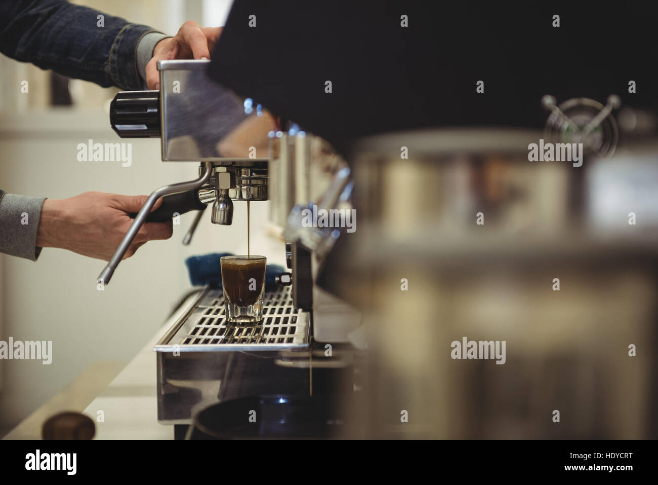 Mid section of man preparing coffee in the coffee shop Stock Photo - Alamy