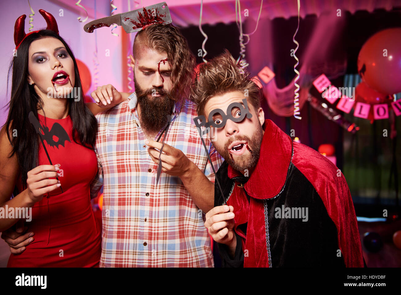 Three friends at the halloween party Stock Photo - Alamy
