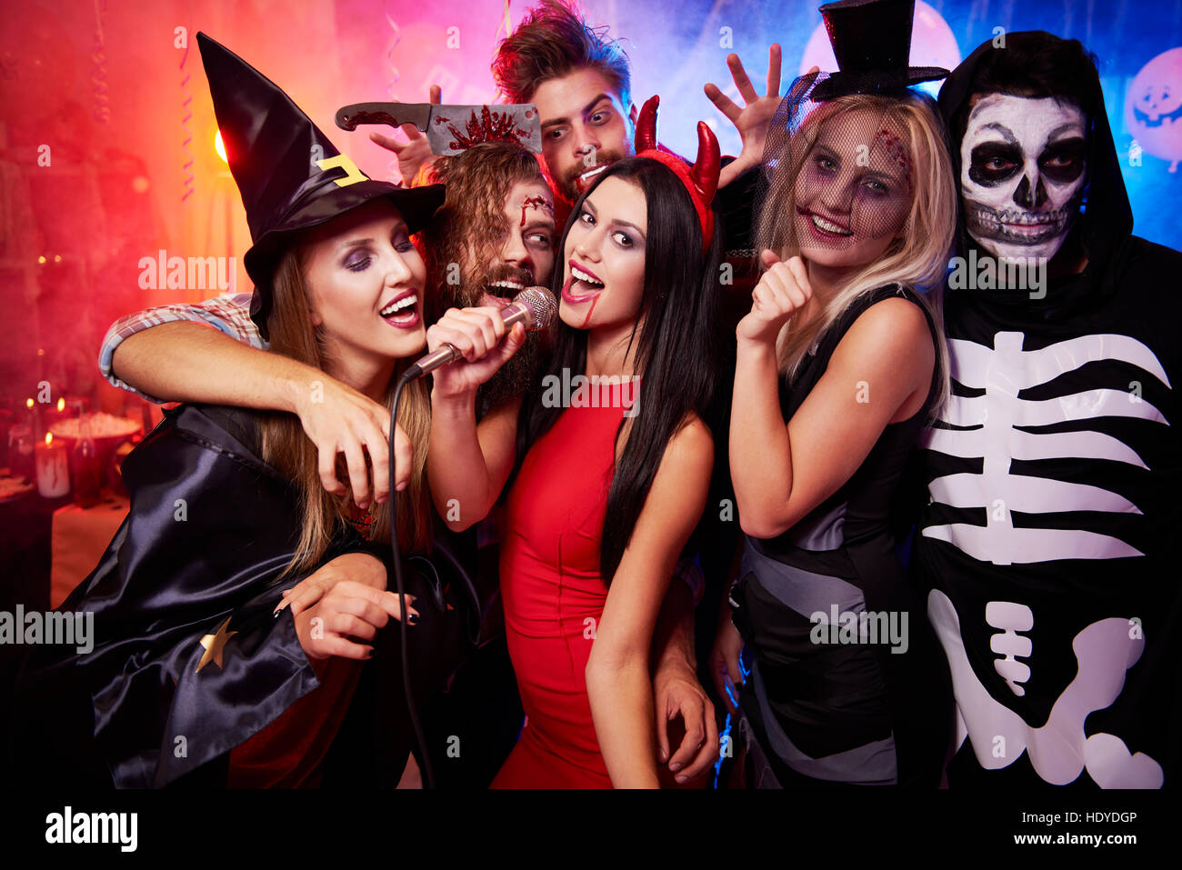 Friends singing together at the party Stock Photo - Alamy
