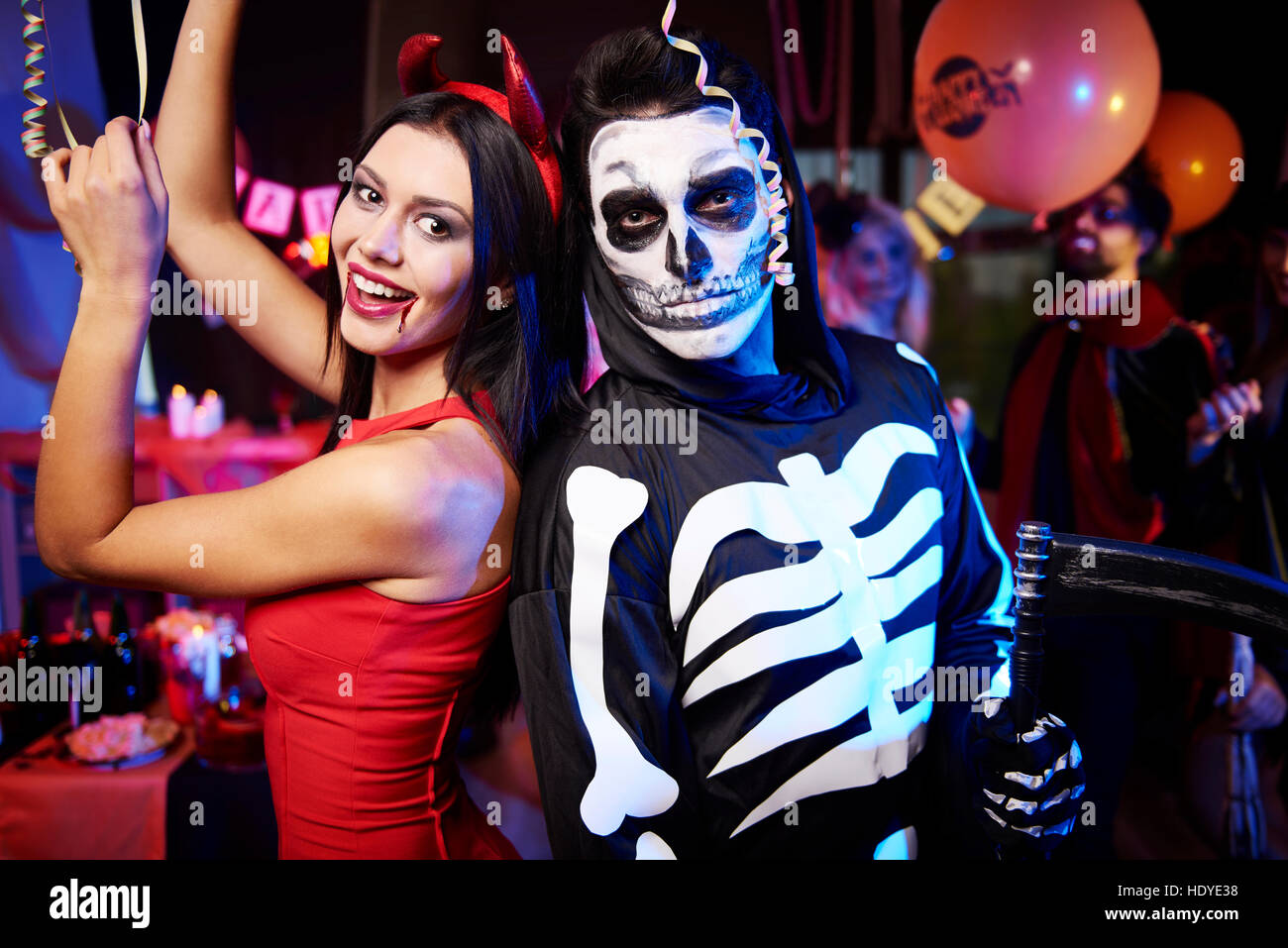 Creepy couple on the night party Stock Photo - Alamy