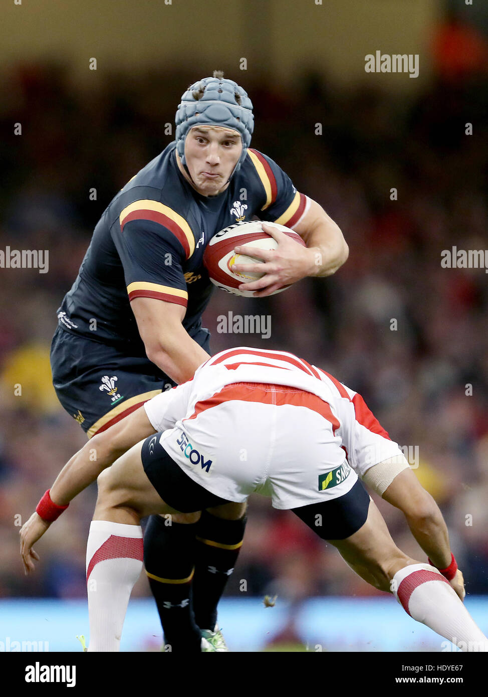 Wales' Jonathan Davies is challenged by Japan's Yu Tamura during the ...