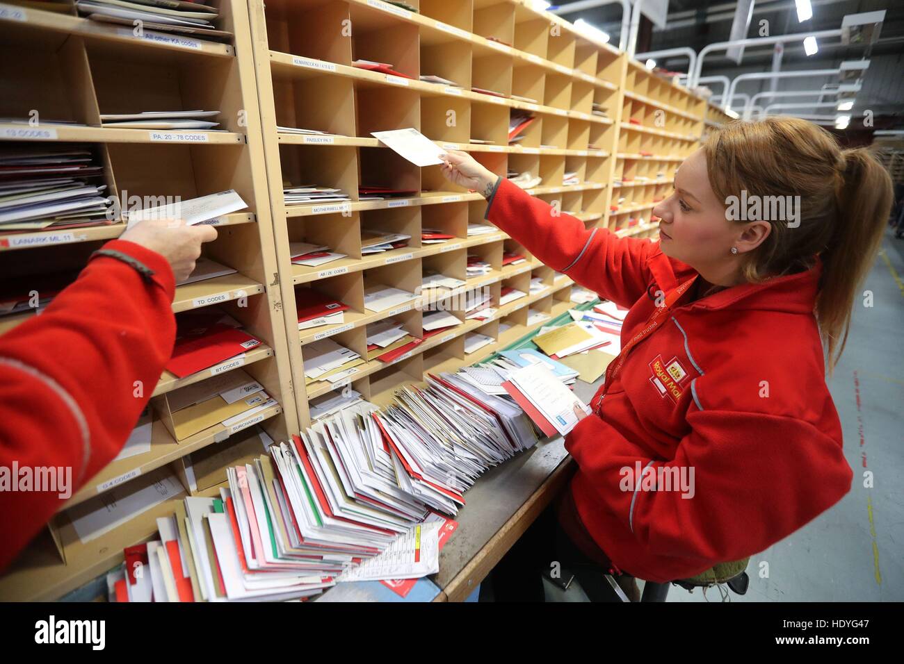 Royal Mail worker Paula Carey sorts mail at the Royal Mail's Sorting ...