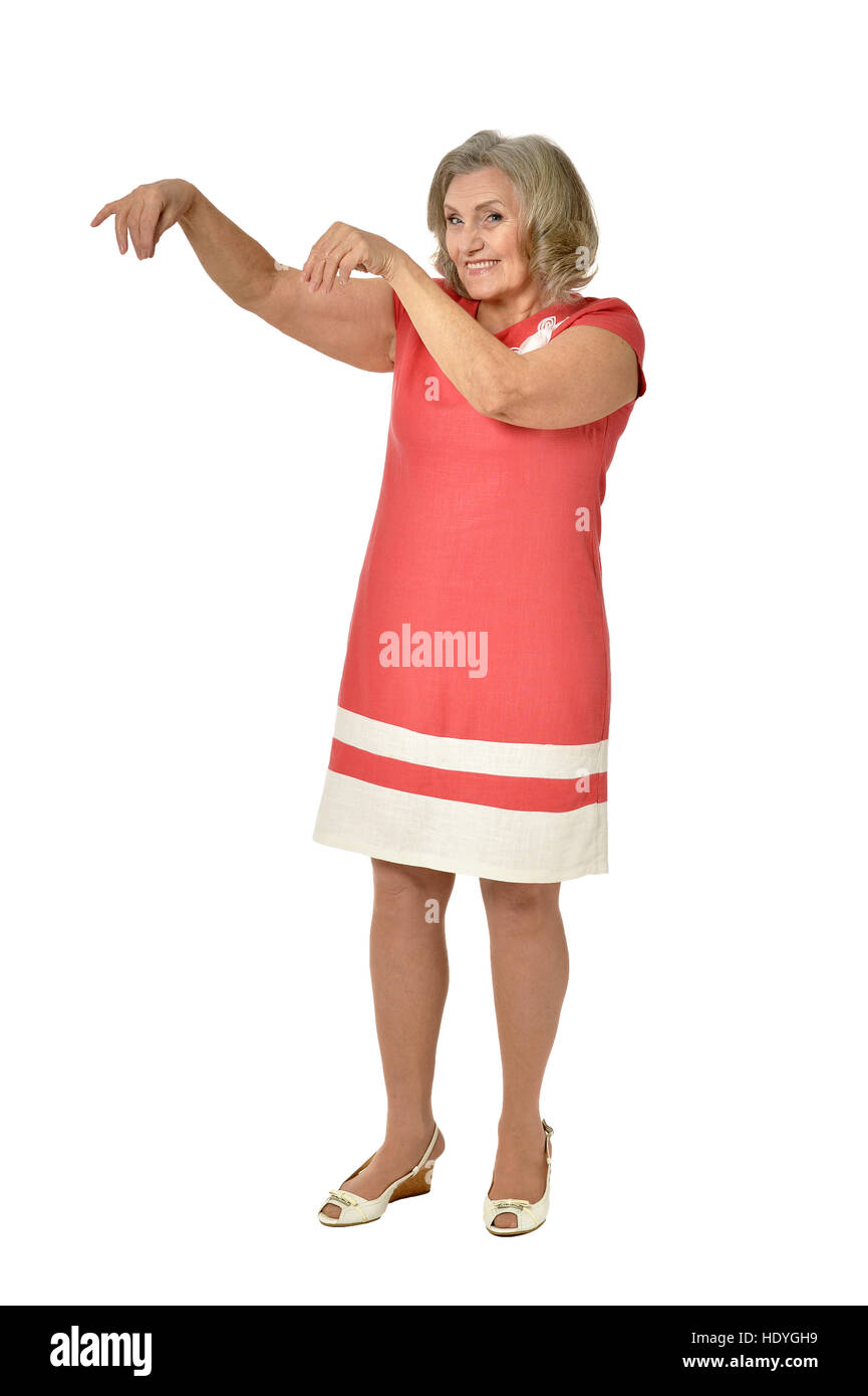 Elderly woman in dress pointing Stock Photo - Alamy
