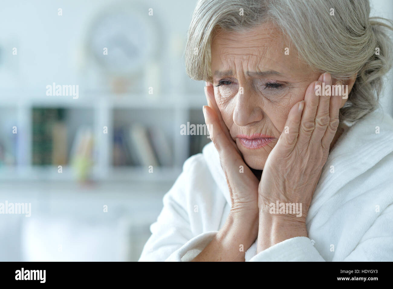 Sad senior woman Stock Photo - Alamy